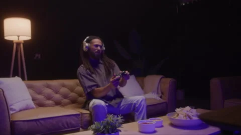 Focused Male Gamer with Dreadlocks and H... | Stock Video | Pond5