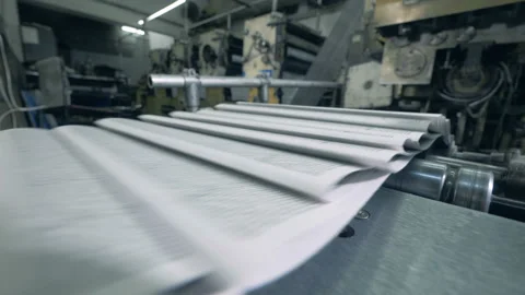Folded paper pages are moving along the ... | Stock Video | Pond5