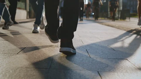 Following male feet steps walking street... | Stock Video | Pond5