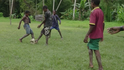 Following shot, indigenous kids playing ... | Stock Video | Pond5