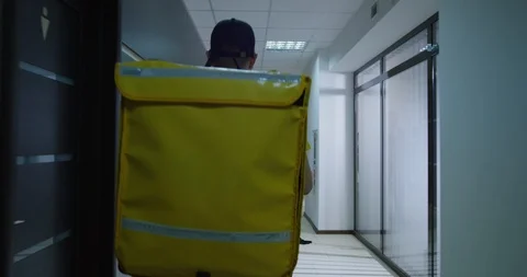 Food delivery boy running to businessman | Stock Video | Pond5