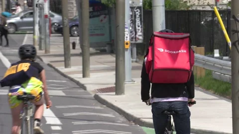 Food delivery courier on bike for Doorda... | Stock Video | Pond5