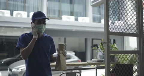 food delivery man deliver order to custo... | Stock Video | Pond5