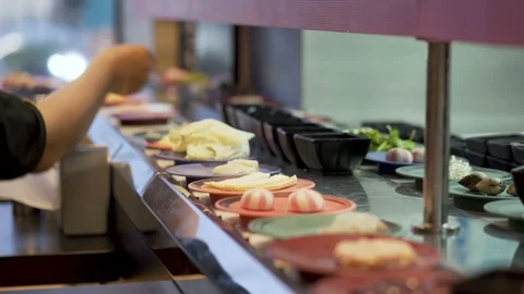 Food on the plate that moves along the b... | Stock Video | Pond5