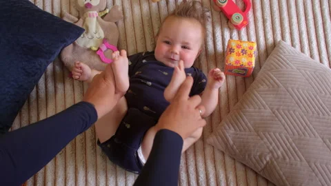Foot massage for a baby. Friction of the... | Stock Video | Pond5