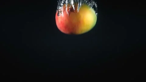 Footage of falling mango in the water on... | Stock Video | Pond5