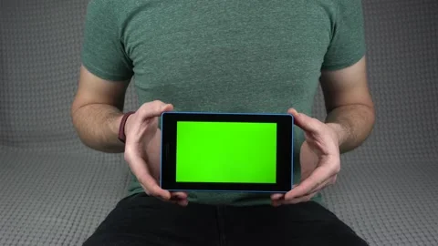 Footage of man showing green screen on t... | Stock Video | Pond5