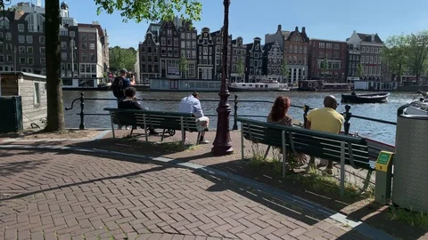 Footage of people sitting on benches by ... | Stock Video | Pond5