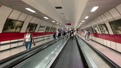 Footage of people walking on moving walk... | Stock Video | Pond5
