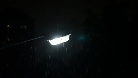Footage Rain Drops Falling street light ... | Stock Video | Pond5