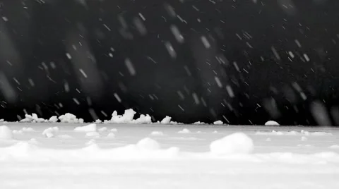 Footage of snow falling isolated on a bl... | Stock Video | Pond5