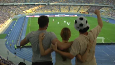 Football fans jumping at stadium, friend... | Stock Video | Pond5