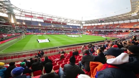 Football field and spectator stands befo... | Stock Video | Pond5