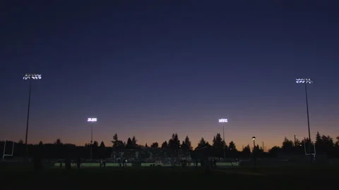 Football Field Lit up at Night | Stock Video | Pond5
