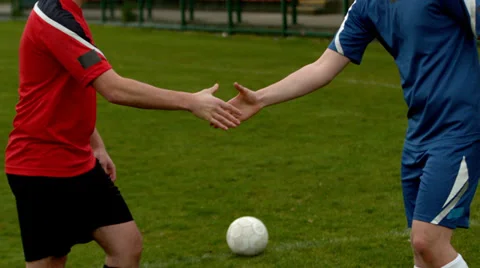 Football players shaking hands before a ... | Stock Video | Pond5