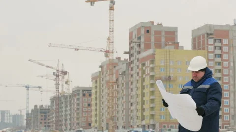 Foreman with paper drawing plan at const... | Stock Video | Pond5