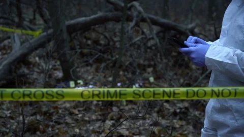 Forensic analyst working at crime scene,... | Stock Video | Pond5