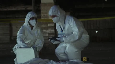 Forensic Experts Examining Corpse at Cri... | Stock Video | Pond5