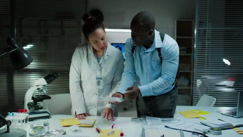 Forensic Scientist and Police Officer So... | Stock Video | Pond5