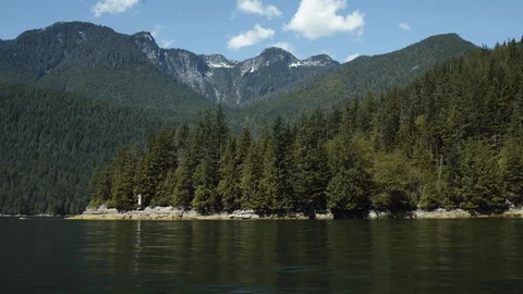 Foresty Island with Majestic mountains i... | Stock Video | Pond5
