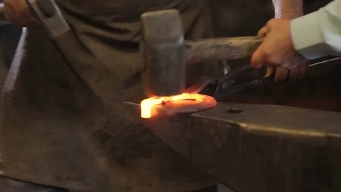 Forge iron in the forge on the anvil. | Stock Video | Pond5