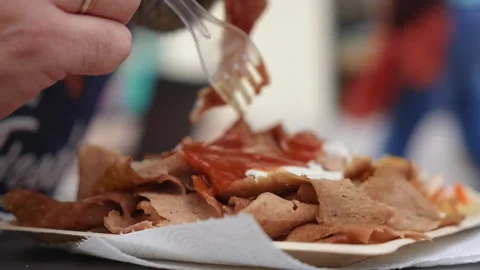 Fork picking up street food with sheep m... | Stock Video | Pond5