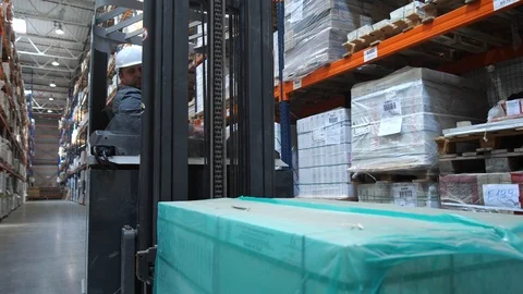 A forklift with a box rides along the st... | Stock Video | Pond5