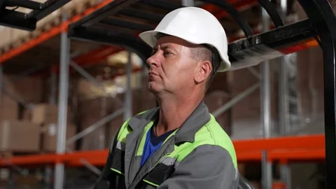 Forklift driver in hard hat during work ... | Stock Video | Pond5