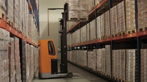 Forklift lifts a pallet load of boxes on... | Stock Video | Pond5