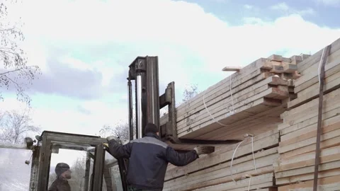 Forklift load stack of wood planks on he... | Stock Video | Pond5