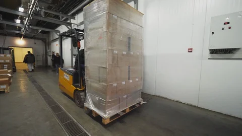 forklift loader carries cardboard boxes ... | Stock Video | Pond5