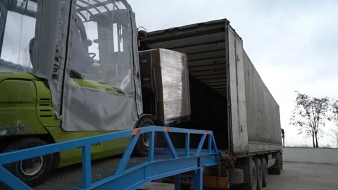 Forklift Loader Load Boxes Into A Truck | Stock Video | Pond5