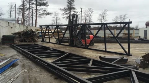 Forklift loading and unloading metal str... | Stock Video | Pond5