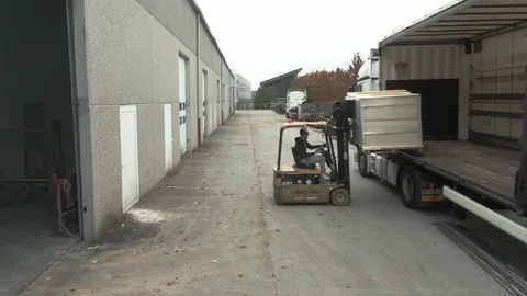Forklift loading and unloading a truck i... | Stock Video | Pond5