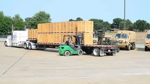Forklift truck unloading wooden crates f... | Stock Video | Pond5
