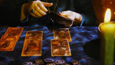 A fortune teller hands in rings at a tab... | Stock Video | Pond5