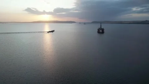 forward aerial view sunrise over oil gas... | Stock Video | Pond5