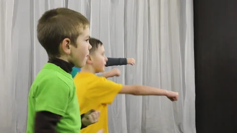 Four active athletes train punches with ... | Stock Video | Pond5