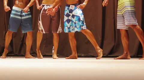 Four bodybuilding winners demonstrating ... | Stock Video | Pond5