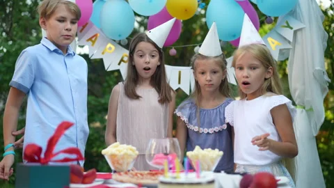 Four cute relaxed kids talking as female... | Stock Video | Pond5