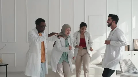 Four fun excited young multiethnic happy... | Stock Video | Pond5