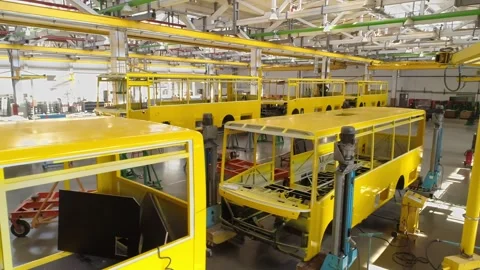 Frames of bus on the conveyor line of th... | Stock Video | Pond5