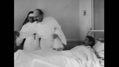 FRANCE - 1910s - A doctor looks over a p... | Stock Video | Pond5