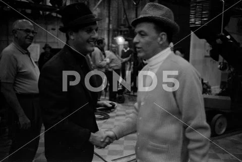 Frank Sinatra shakes hands in his busy Warner Bros Studio, Burbank ...
