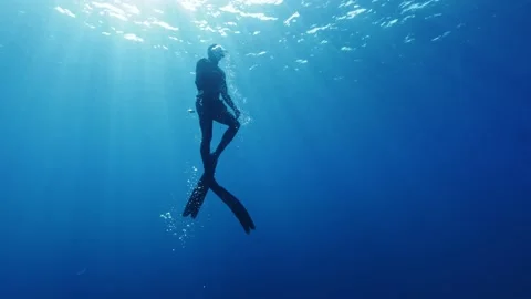 Free Diver Exploring Deep Ocean | Stock Video | Pond5