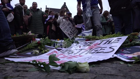 'Free the hostages' sign, laying flowers... | Stock Video | Pond5