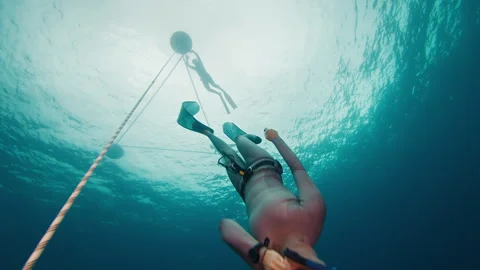 Freediver descends works along the rope.... | Stock Video | Pond5