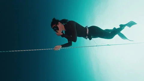 Freediver works out on rope. Woman free ... | Stock Video | Pond5