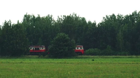A freight train passing through the rain... | Stock Video | Pond5
