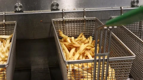 French Fries Cooling Off In Fryer Basket... | Stock Video | Pond5